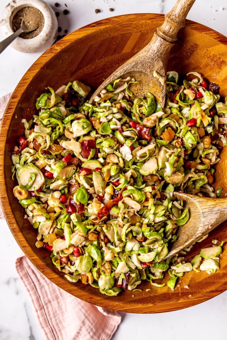 SHAVED BRUSSELS SPROUT SALAD WITH SHALLOT POMEGRANATE DRESSING